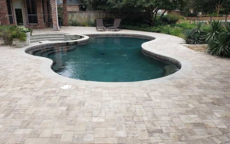 The Cost of Laying Pavers Around a Pool - Backyard Advisor